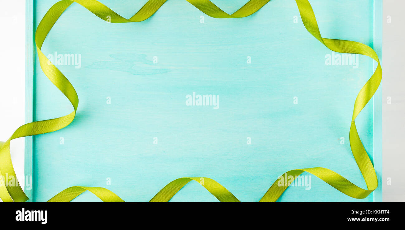 Green ribbon frame on green pastel background Stock Photo - Alamy