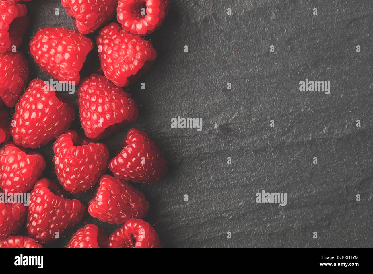 Fresh red raspberries background Stock Photo - Alamy