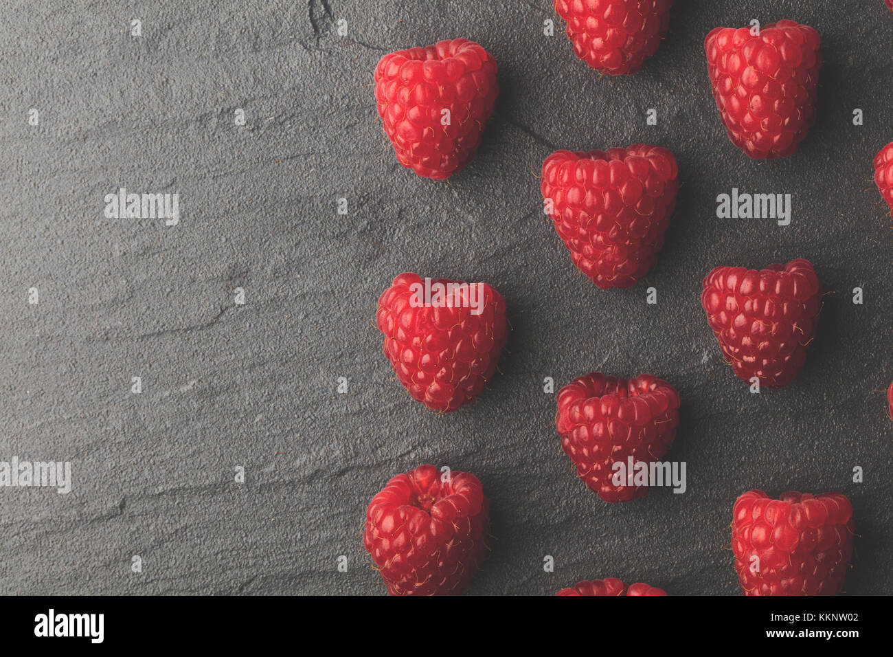 Fresh red raspberries background Stock Photo - Alamy