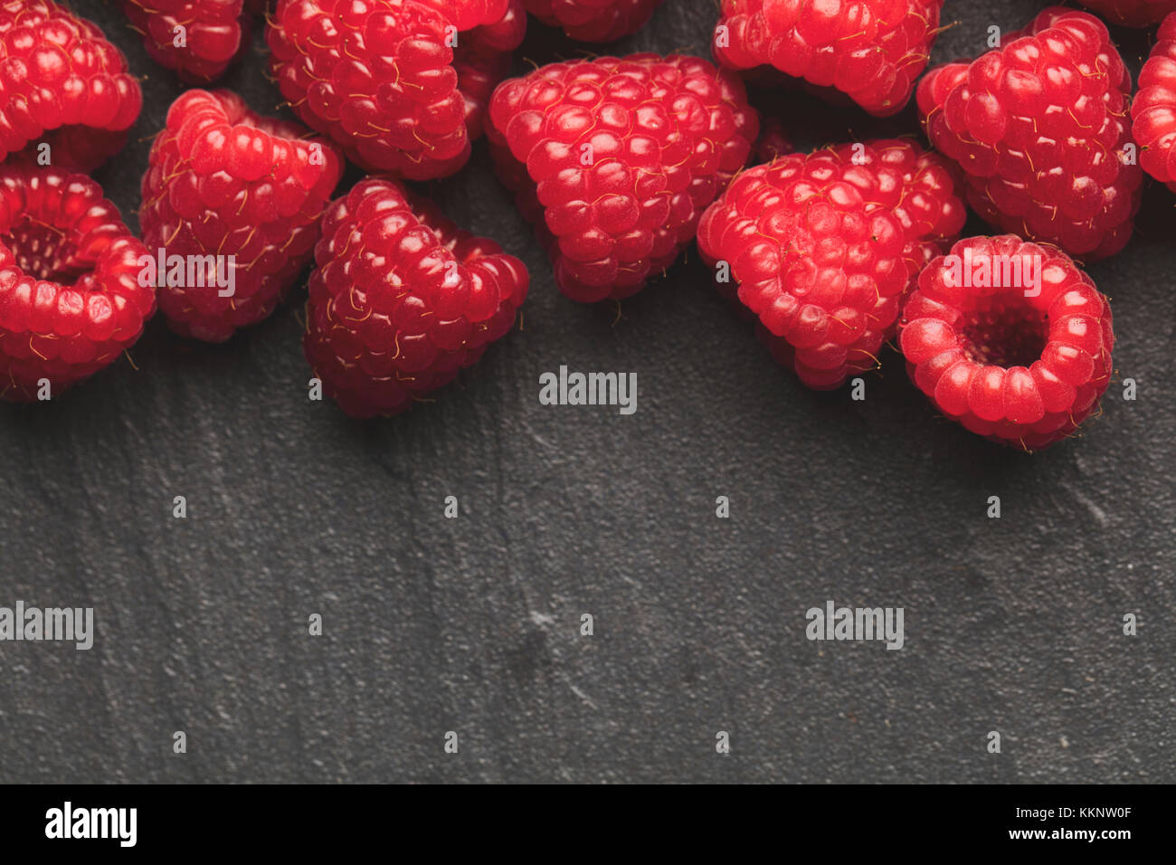 Fresh red raspberries background Stock Photo - Alamy