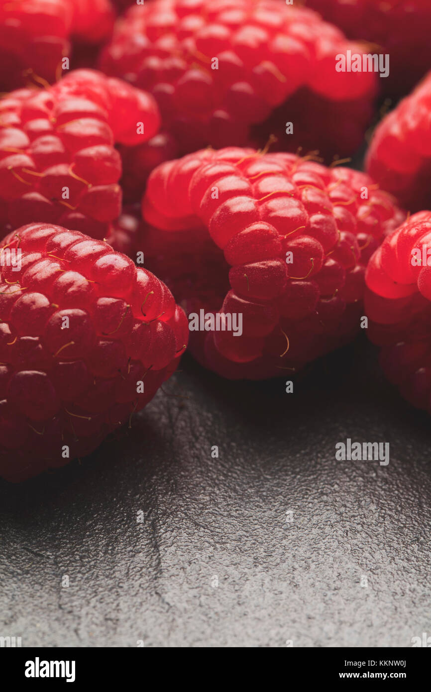 Fresh red raspberries background Stock Photo - Alamy