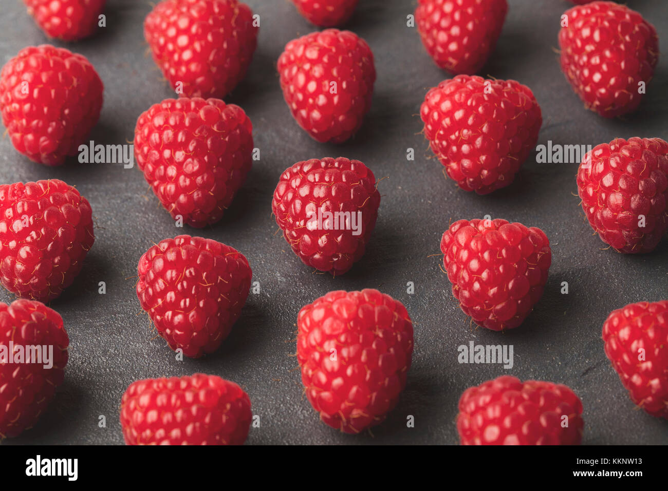 Fresh red raspberries background Stock Photo - Alamy