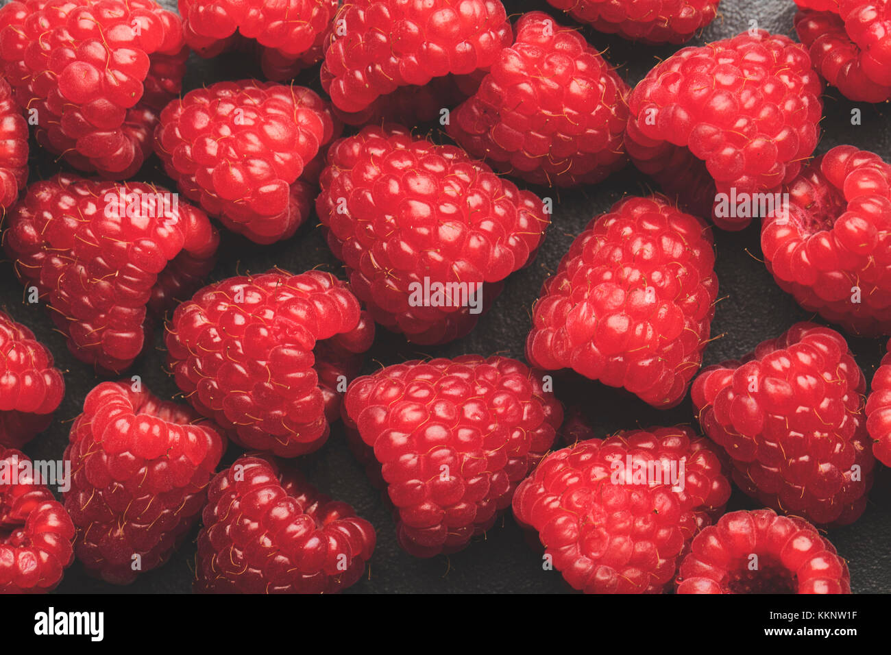 Fresh red raspberries background Stock Photo - Alamy
