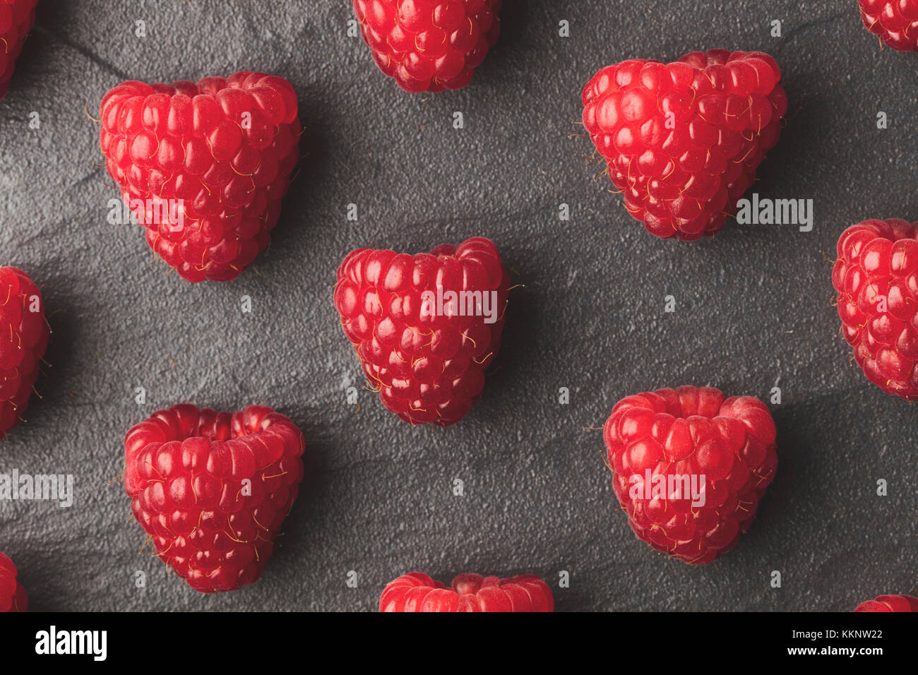 Fresh red raspberries background Stock Photo - Alamy