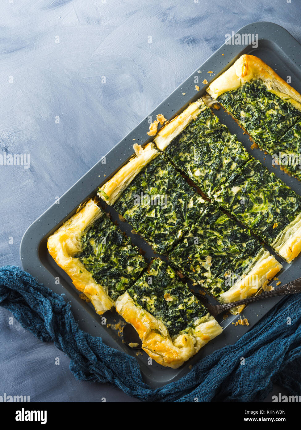 Spinach savory quiche with cream cheese on baking tray Stock Photo - Alamy