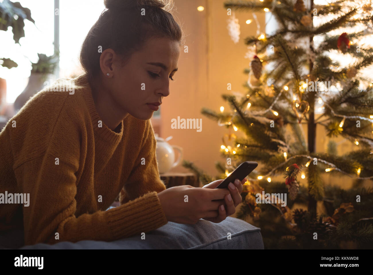 Woman texting christmas hi-res stock photography and images - Alamy