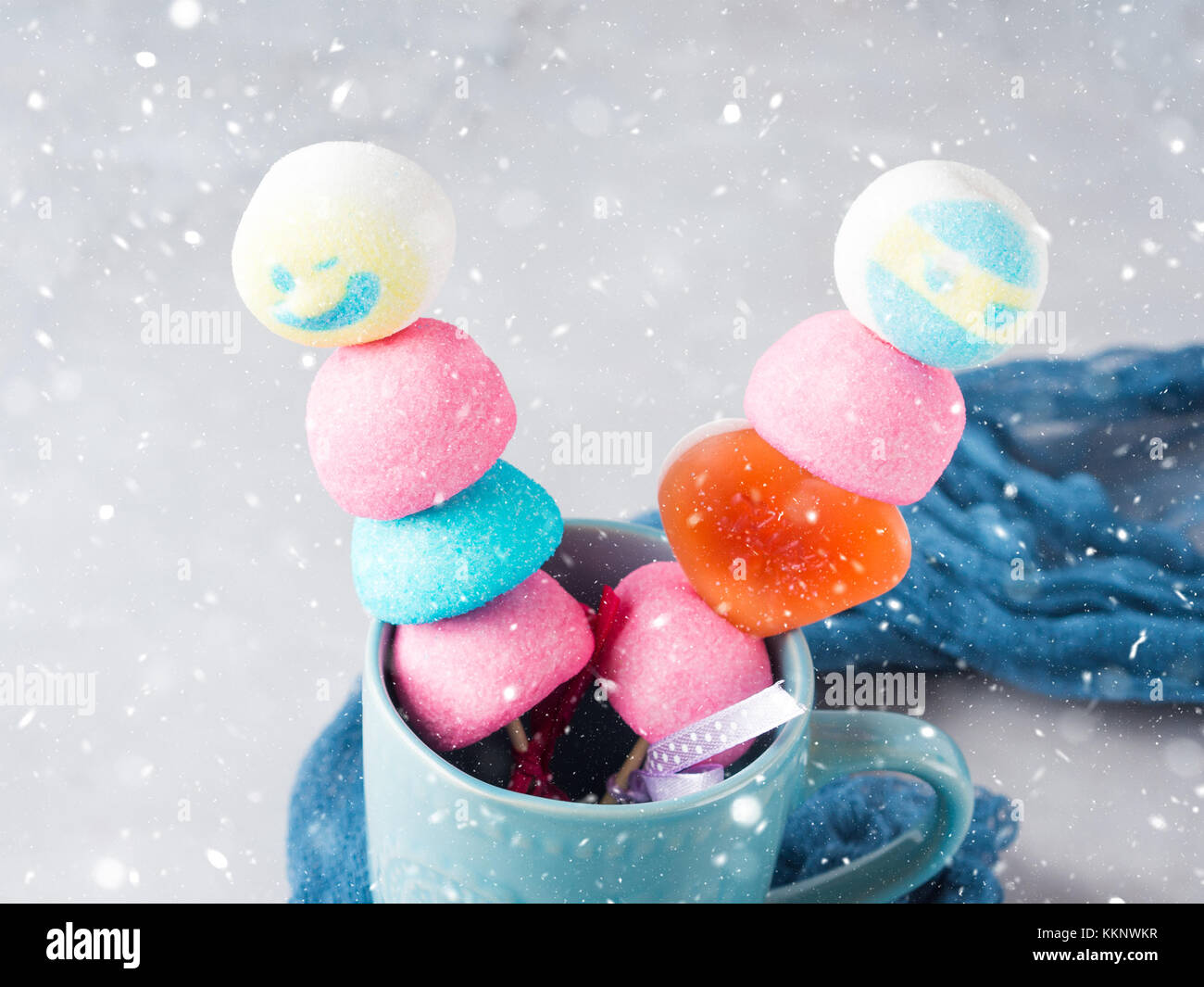 Colorful marshmallows cake pops on wooden sticks with smiling faces ...