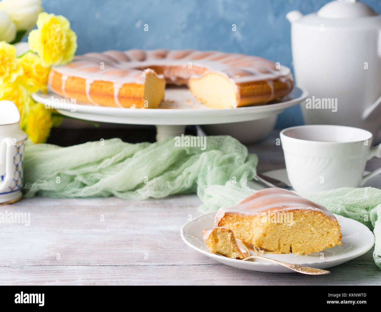 Bundt cake with sugar frosting. Spring breakfast set. Easter festive ...