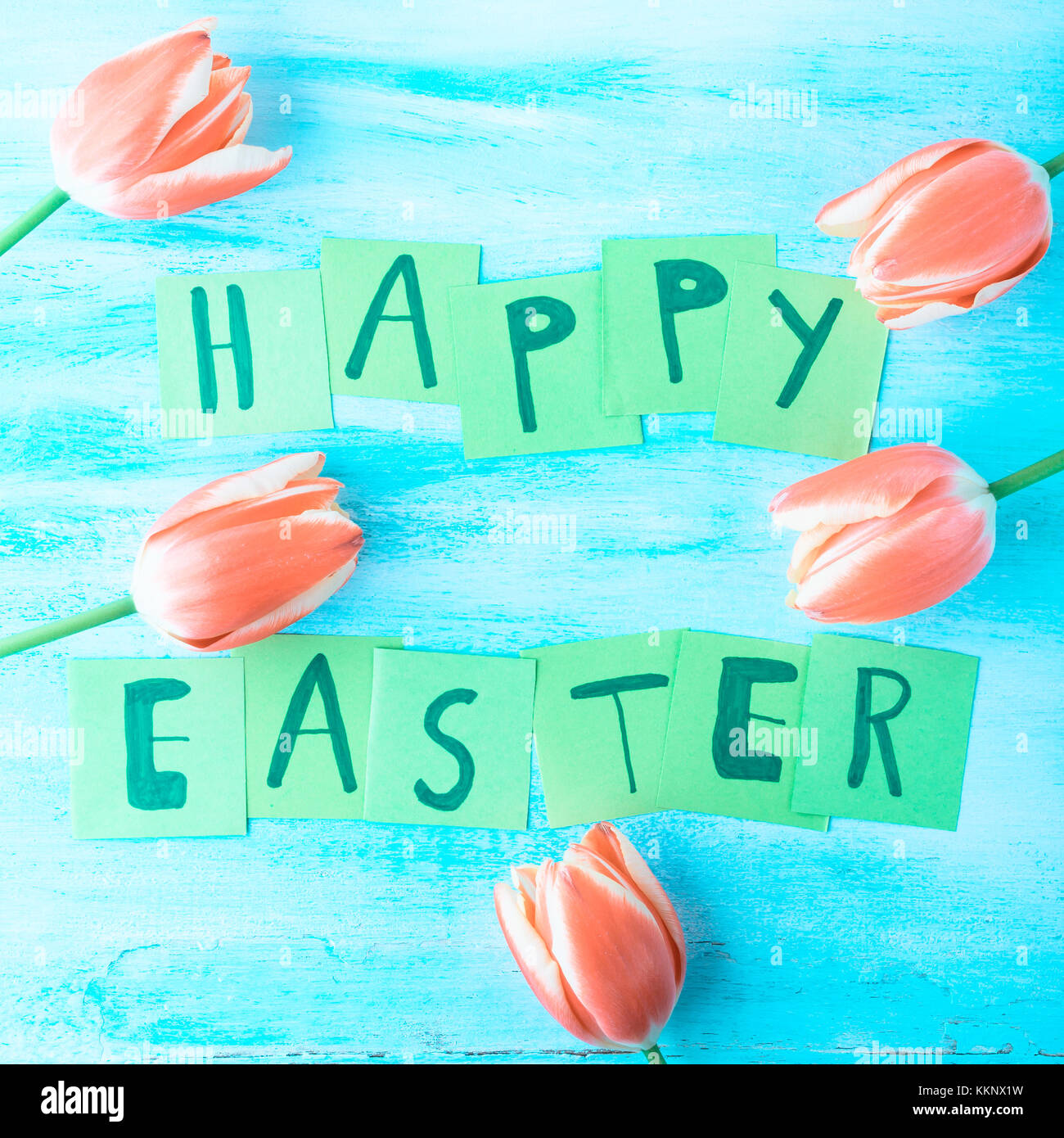 Happy Easter background tulips flowers hand written letters. Green ...