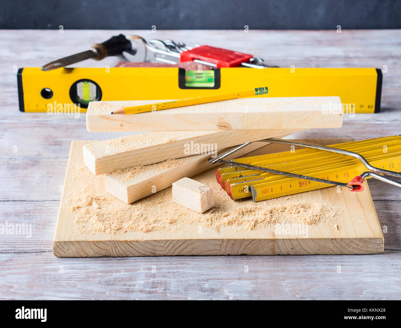 Wooden board with tools for manual measuring cutting - meter, level ...