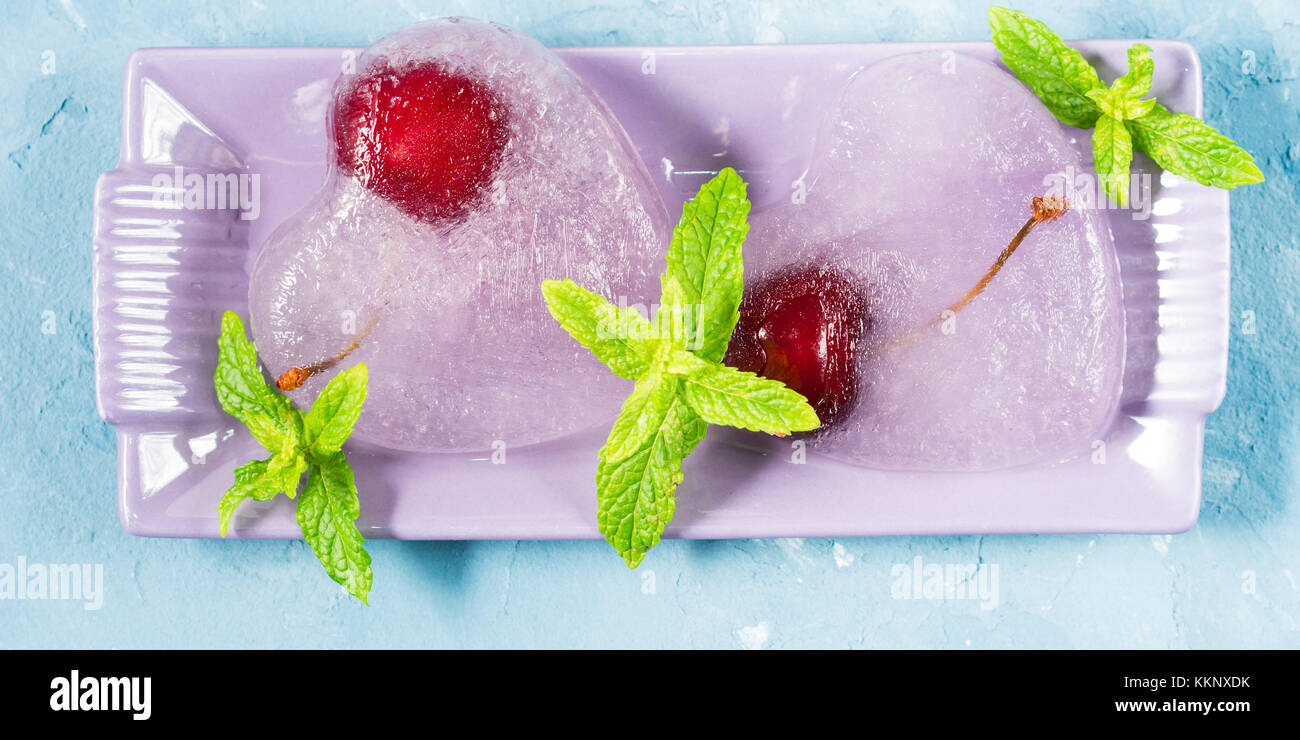 Summer blue textured background ice hearts frozen cherries Stock Photo ...