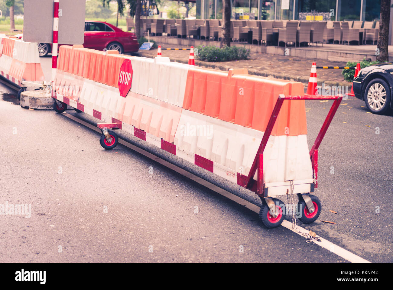 Red stop sign in the middle of a block road movable board Stock Photo ...