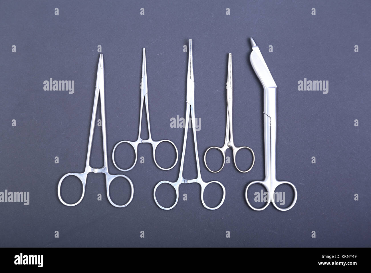 Medical and surgery instruments isolated in black mirror background ...