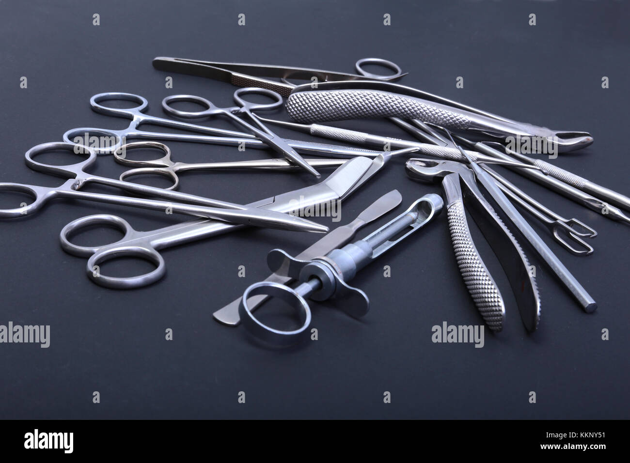 Medical and surgery instruments isolated in black mirror background ...