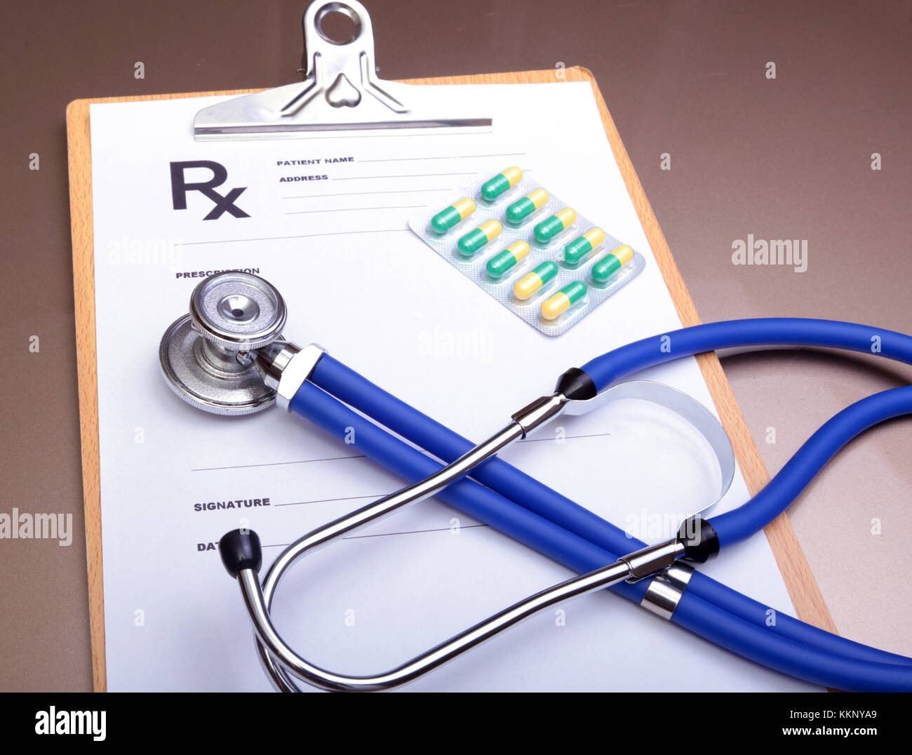 RX prescription, Red heart, asorted pils and a stethoscope on white ...