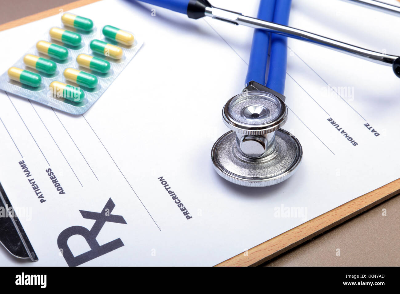 RX prescription, Red heart, asorted pils and a stethoscope on white ...