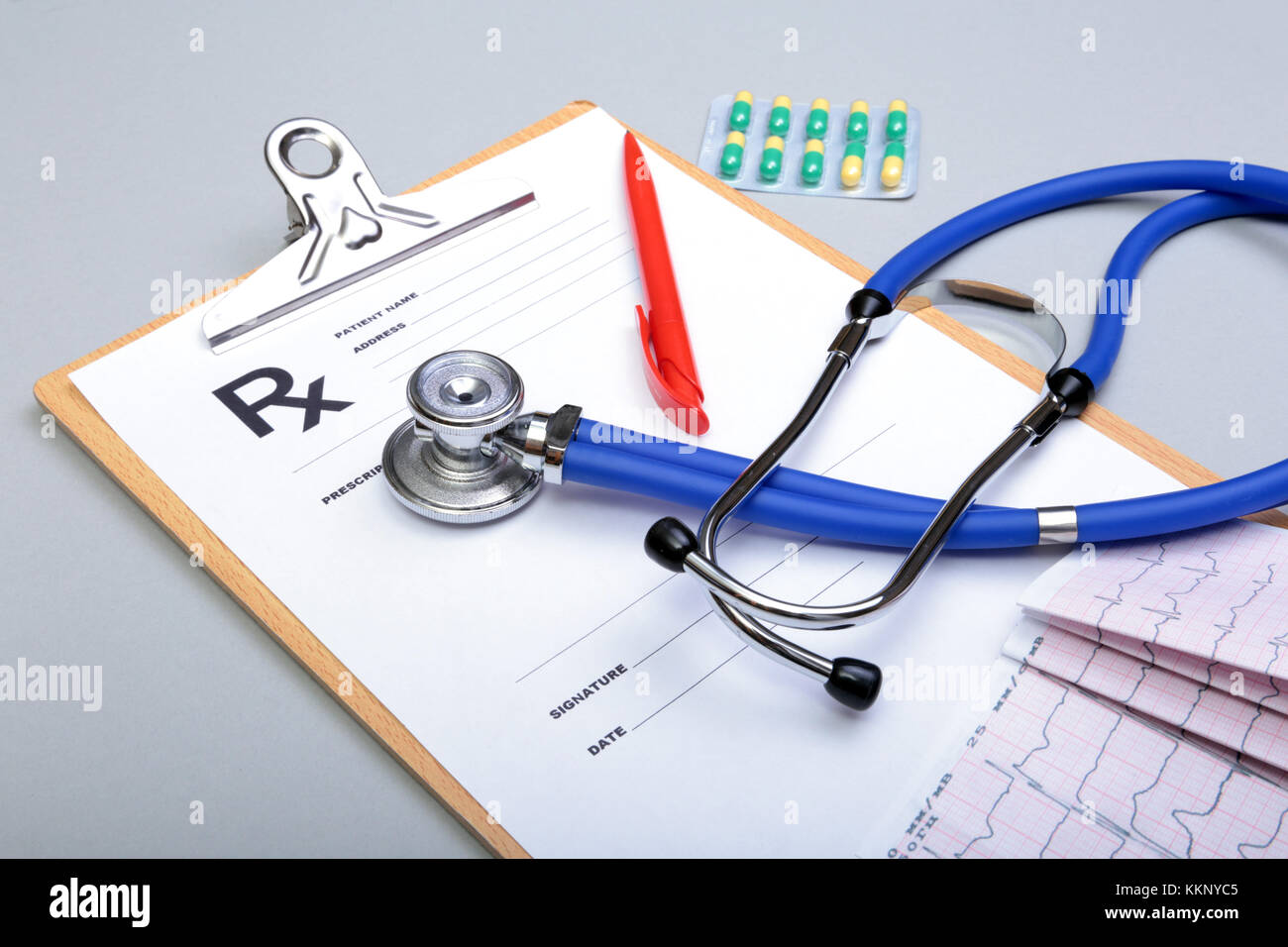 RX prescription, Red heart, asorted pils and a stethoscope on white ...