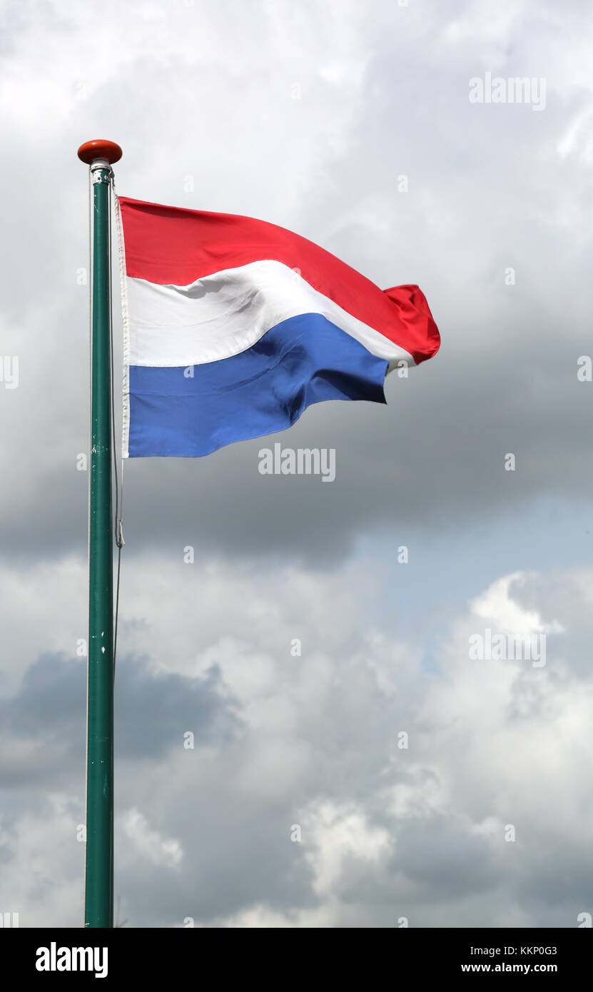 very large Dutch flag waving with cloudy sky Stock Photo - Alamy