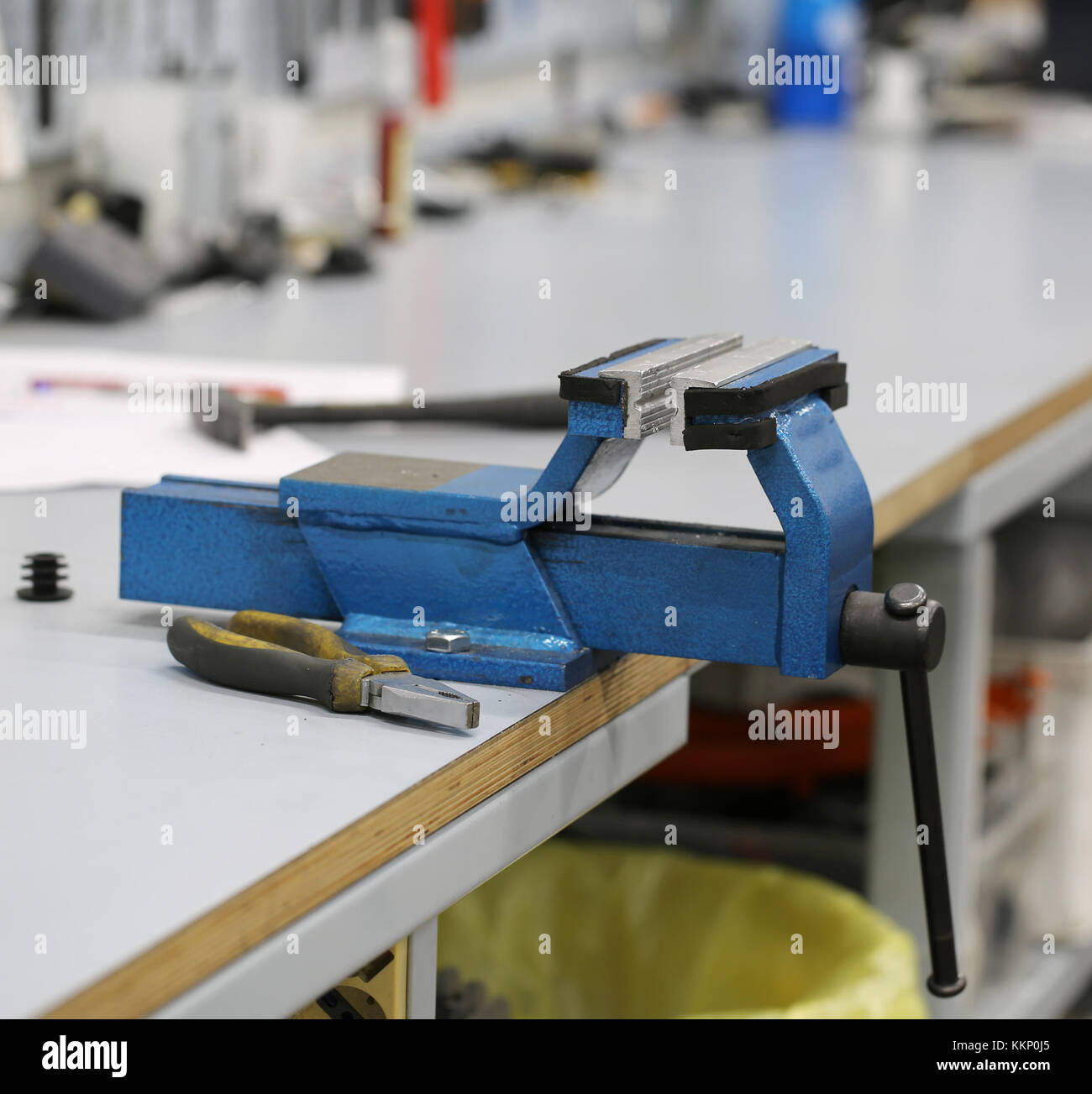 blue vice on the workbench of the mechanical workshop Stock Photo - Alamy