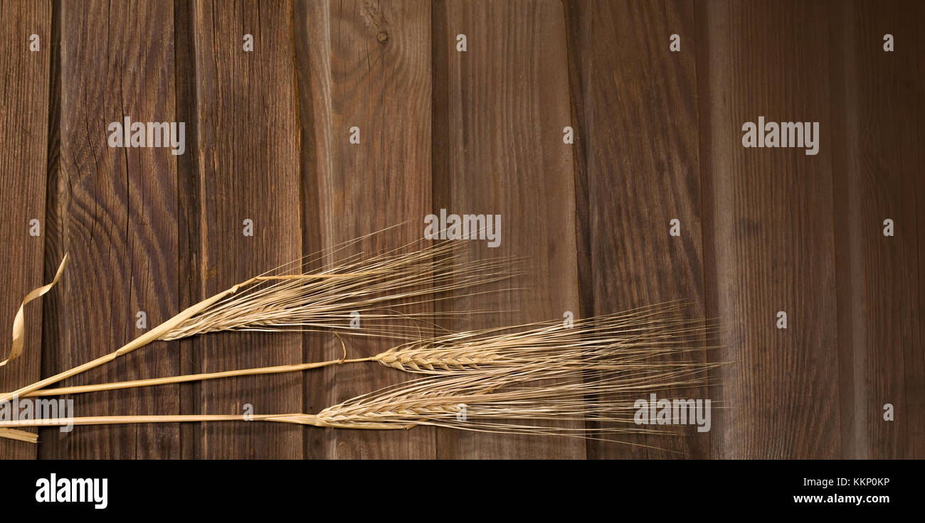 wheat on the wood background Stock Photo - Alamy