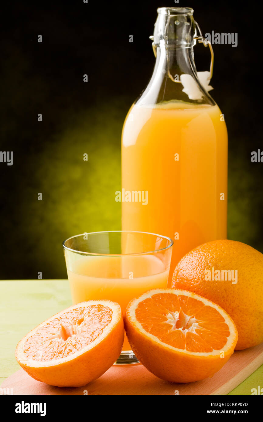 fresh orange juice inside a glass on wooden table Stock Photo - Alamy