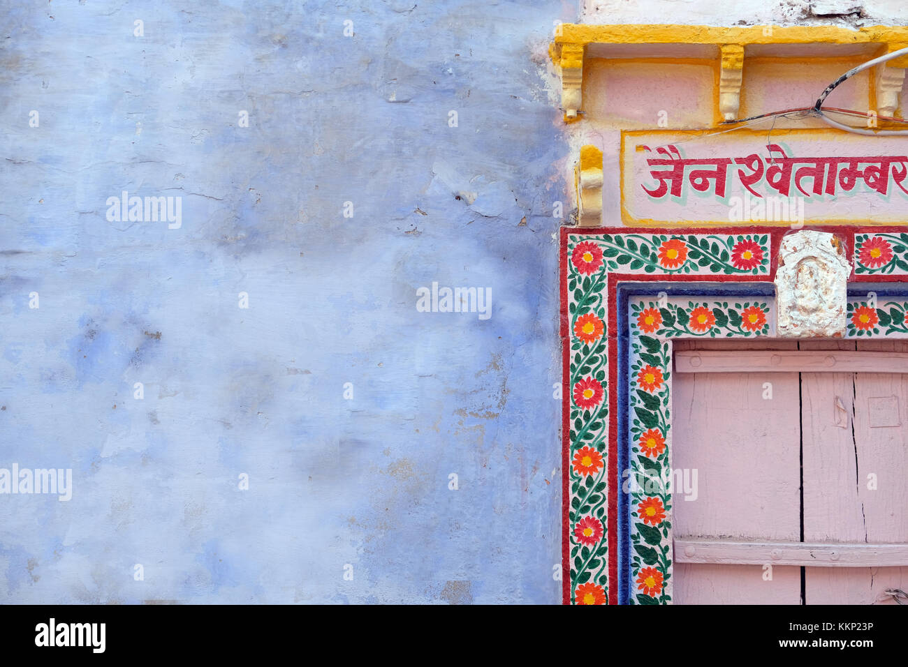 Decorative door frame and blue wall, Bundi,Rajasthan,India Stock Photo ...