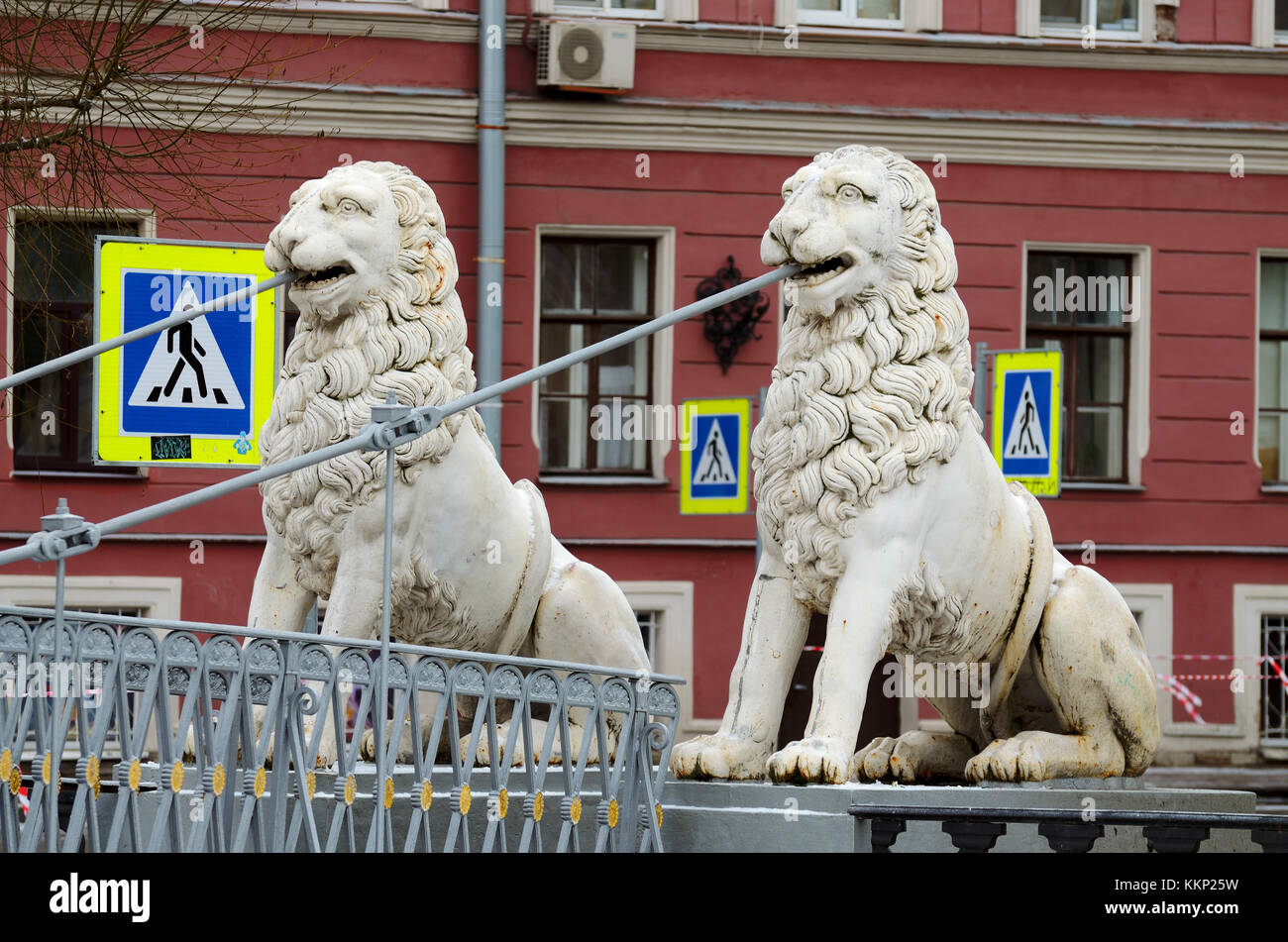 A small bridge over the canal with statues of lions Stock Photo - Alamy
