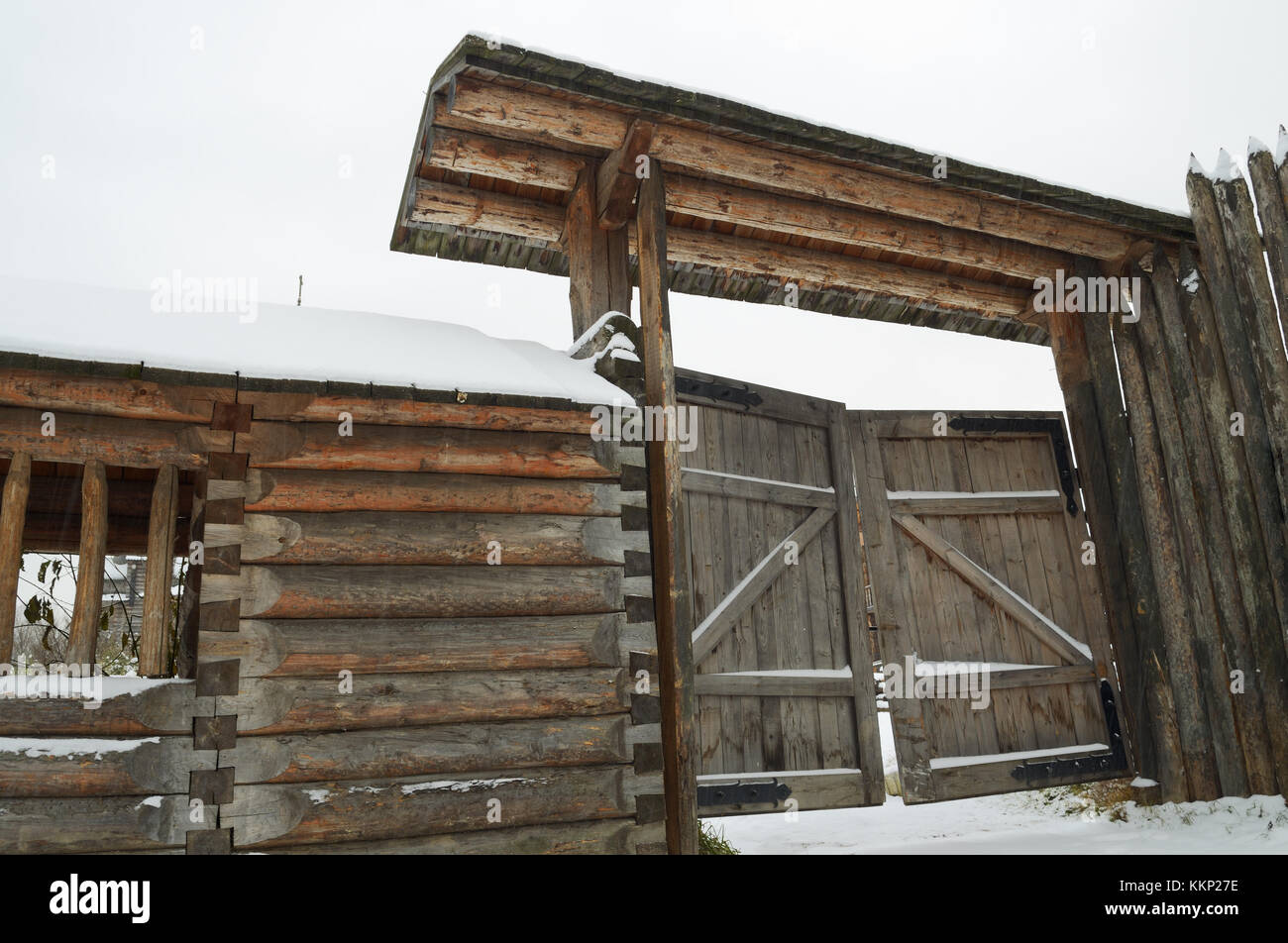 The large wooden gate is closed and bolted Stock Photo - Alamy