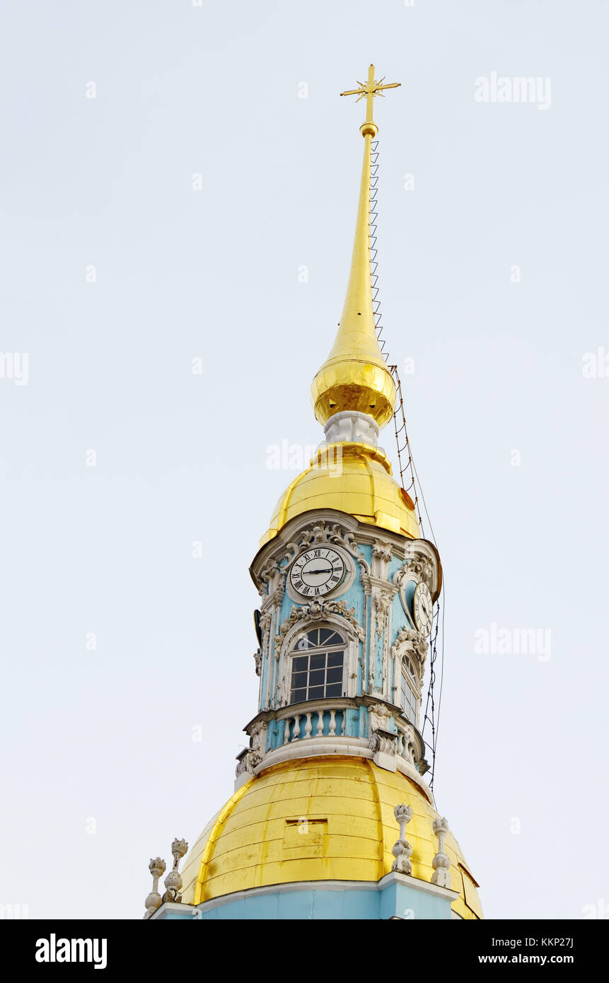 The Golden dome of the bell tower with a clock on the wall Stock Photo ...