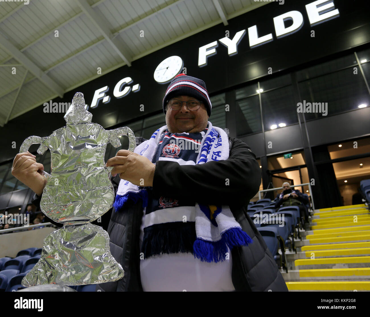 An AFC Fylde fan before the Emirates FA Cup second round match at Mill ...