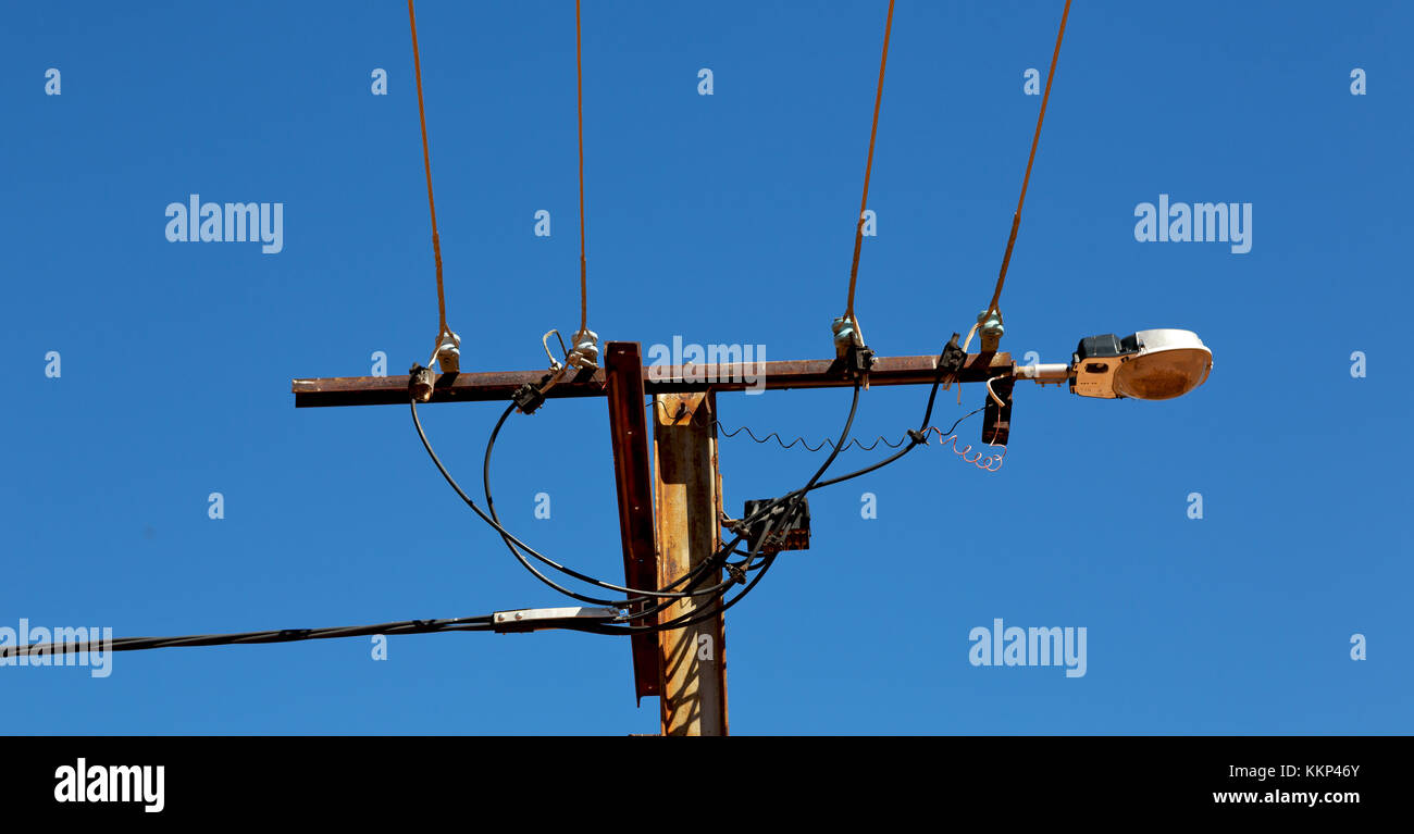 in australia the concept of power line with electrical pole in the clear sky Stock Photo - Alamy