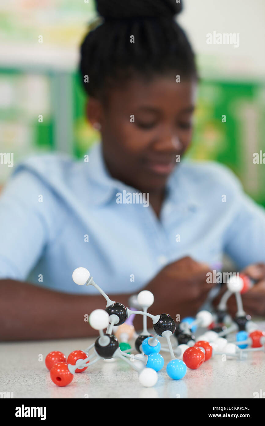 Female Pupil Using Molecular Model Kit In Science Lesson Stock Photo ...