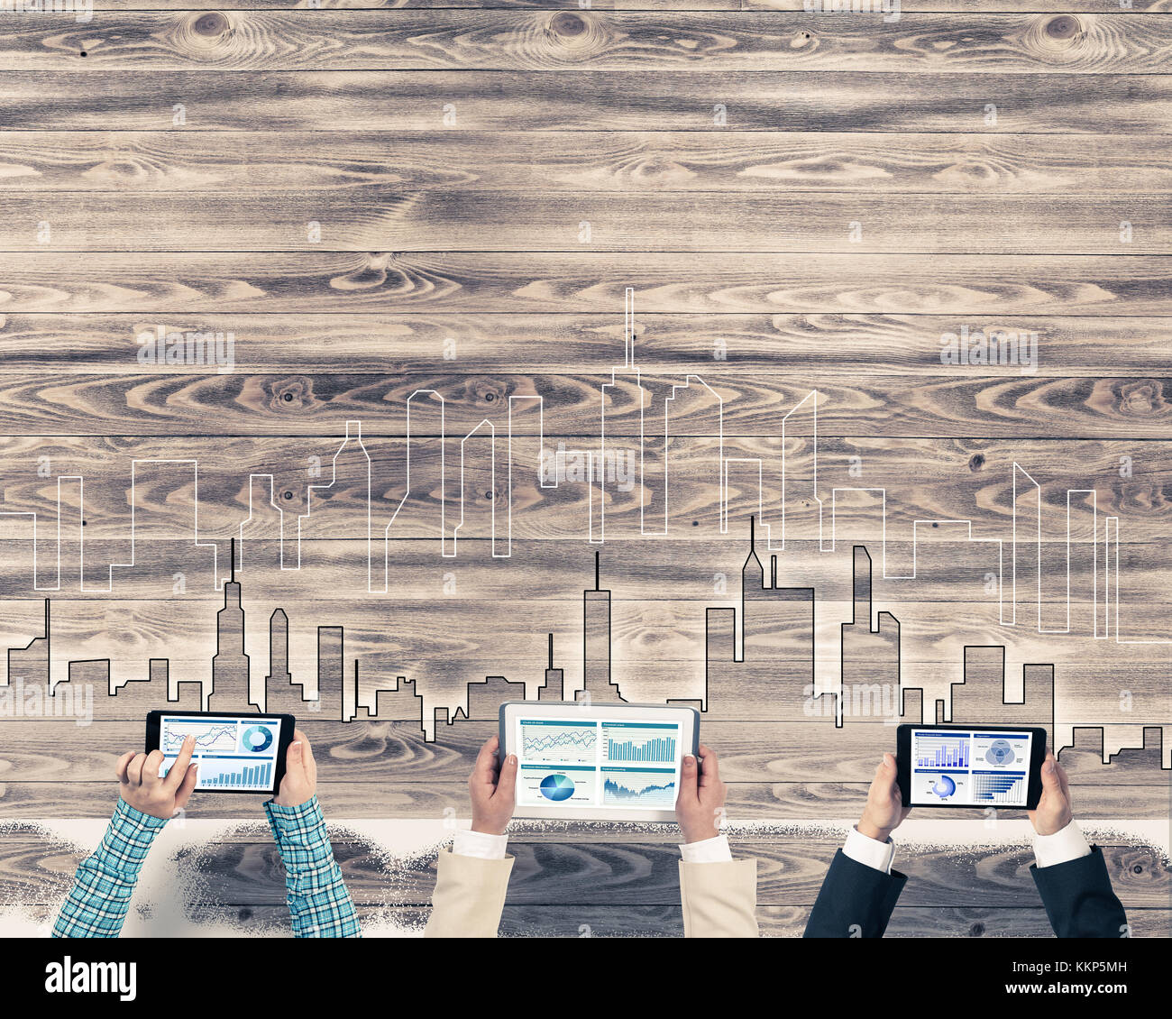 Group of three people with devices in hands working together as symbol ...