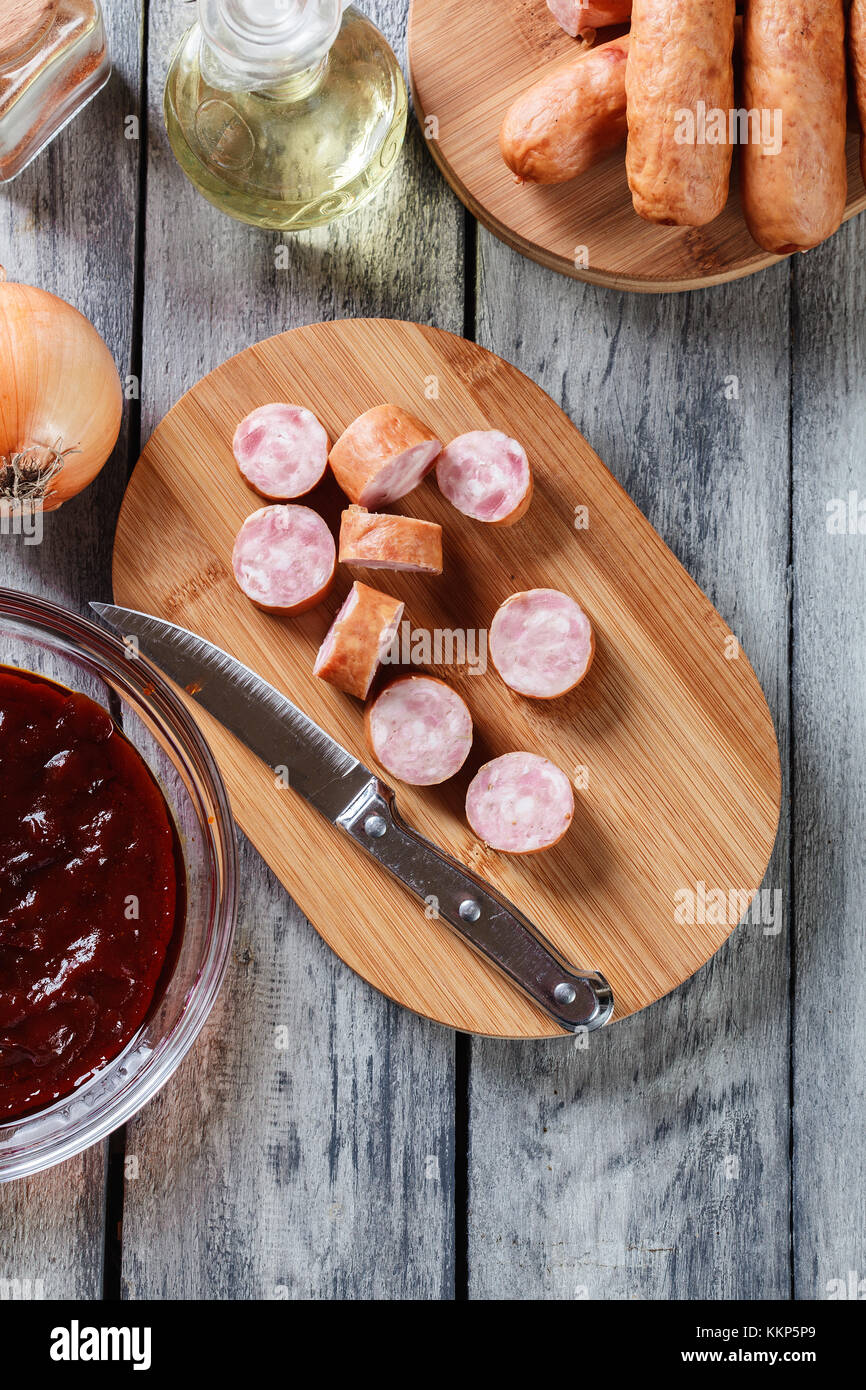 Ingredients ready for preparing German currywurst with curry sauce ...
