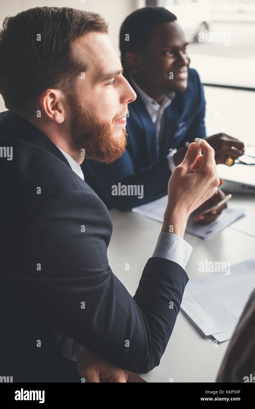 business colleagues cooperating to achieve better results for their ...