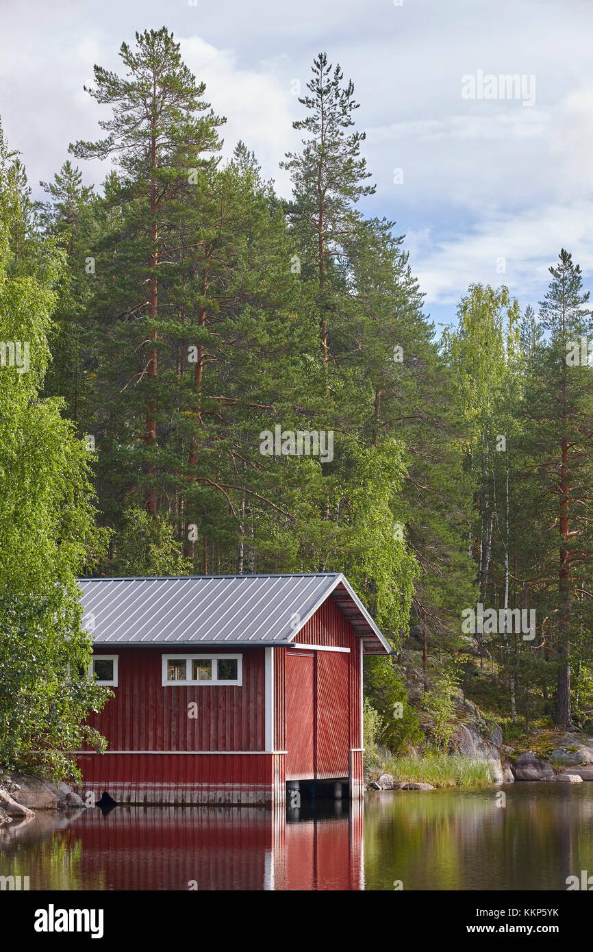 Finland landscape forest lake and red wooden cabin. Finnish summer ...