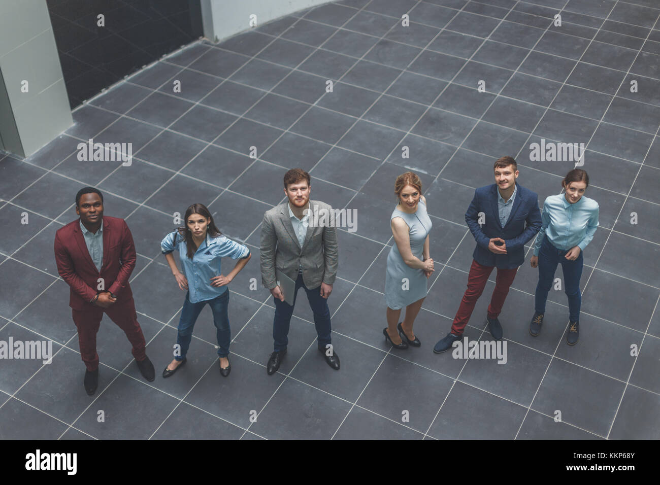 Portrait Of Multi-Cultural Office Staff Standing In Lobby, high angle ...