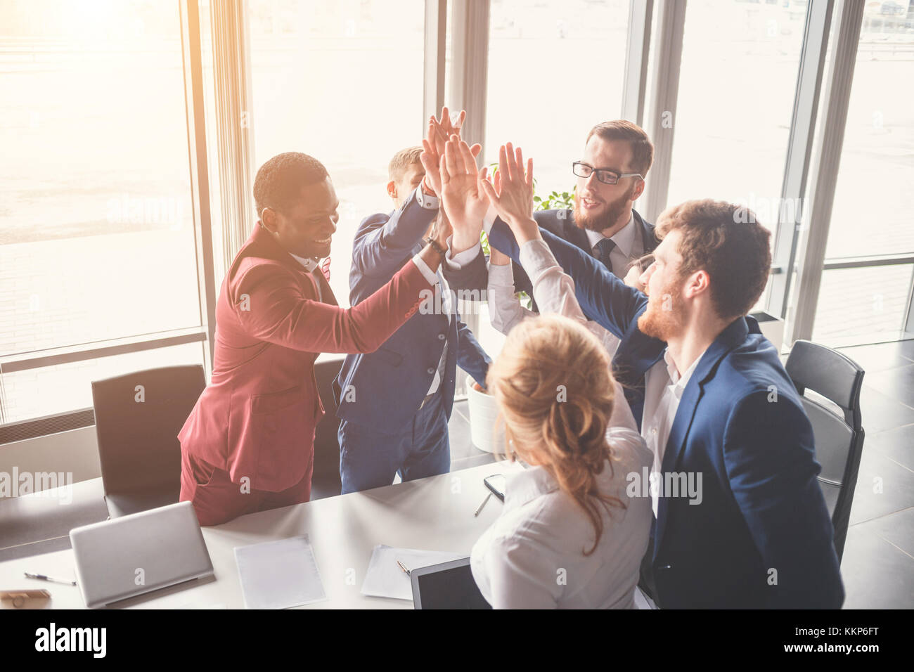Female and male classmates celebrating pathing math examination Stock ...