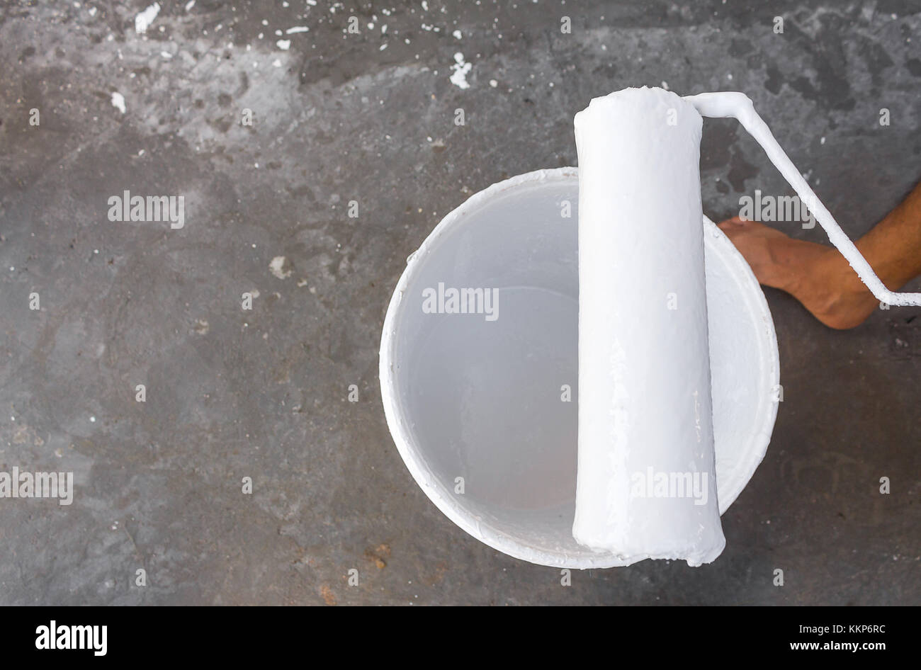 White paint dripping with paint roller, on the edge paint bucket,Top ...