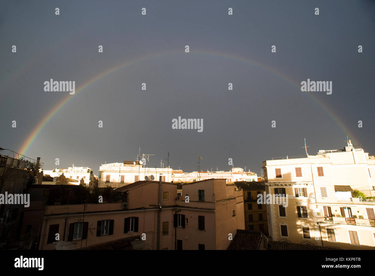 a rainbow overlooking Rome during a rainy day Stock Photo - Alamy