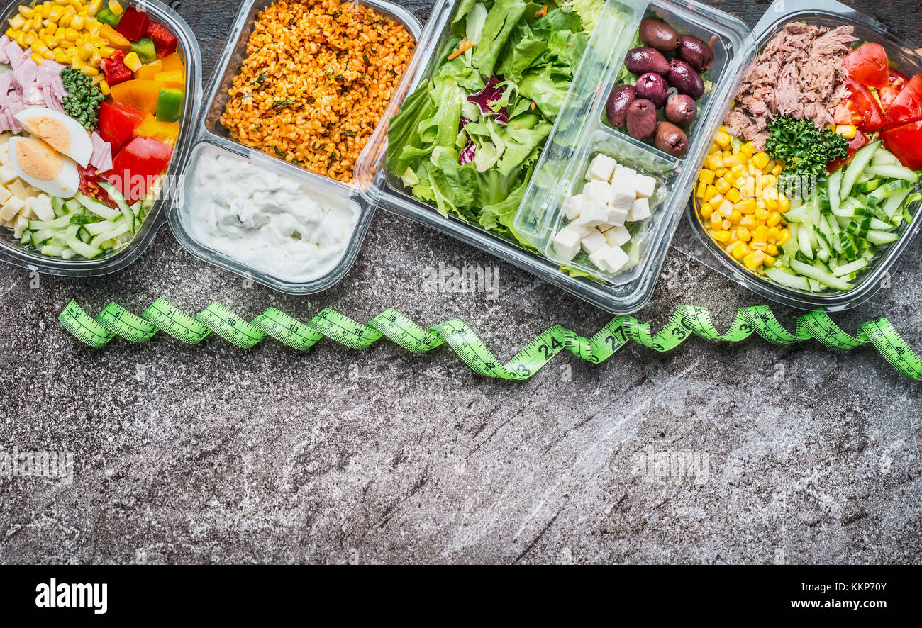 Diet food and lunch boxes concept. Various Healthy vegetables salads in ...