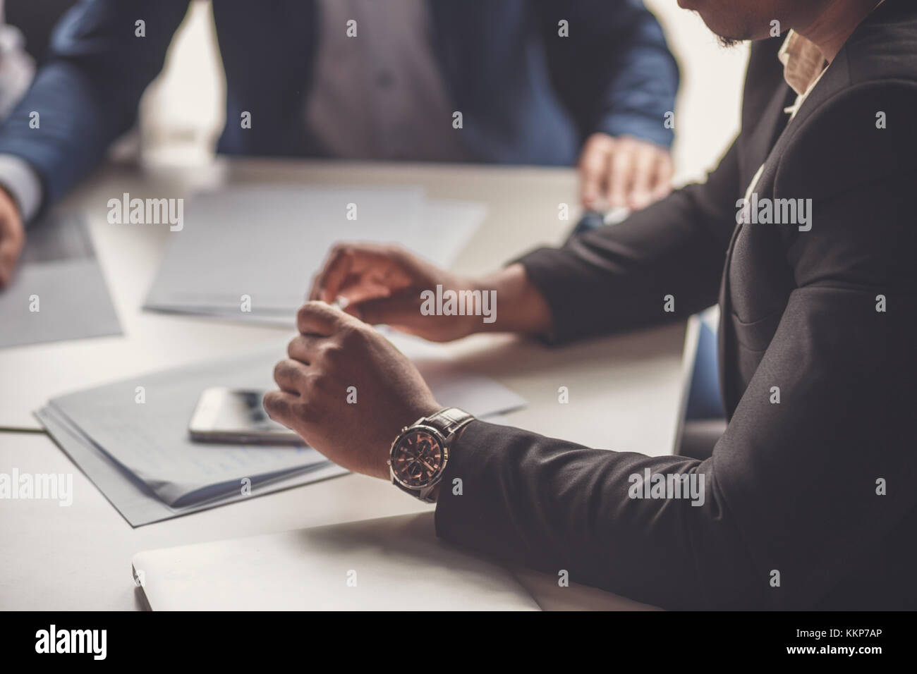 Close up business man hands on table, classic business Stock Photo - Alamy