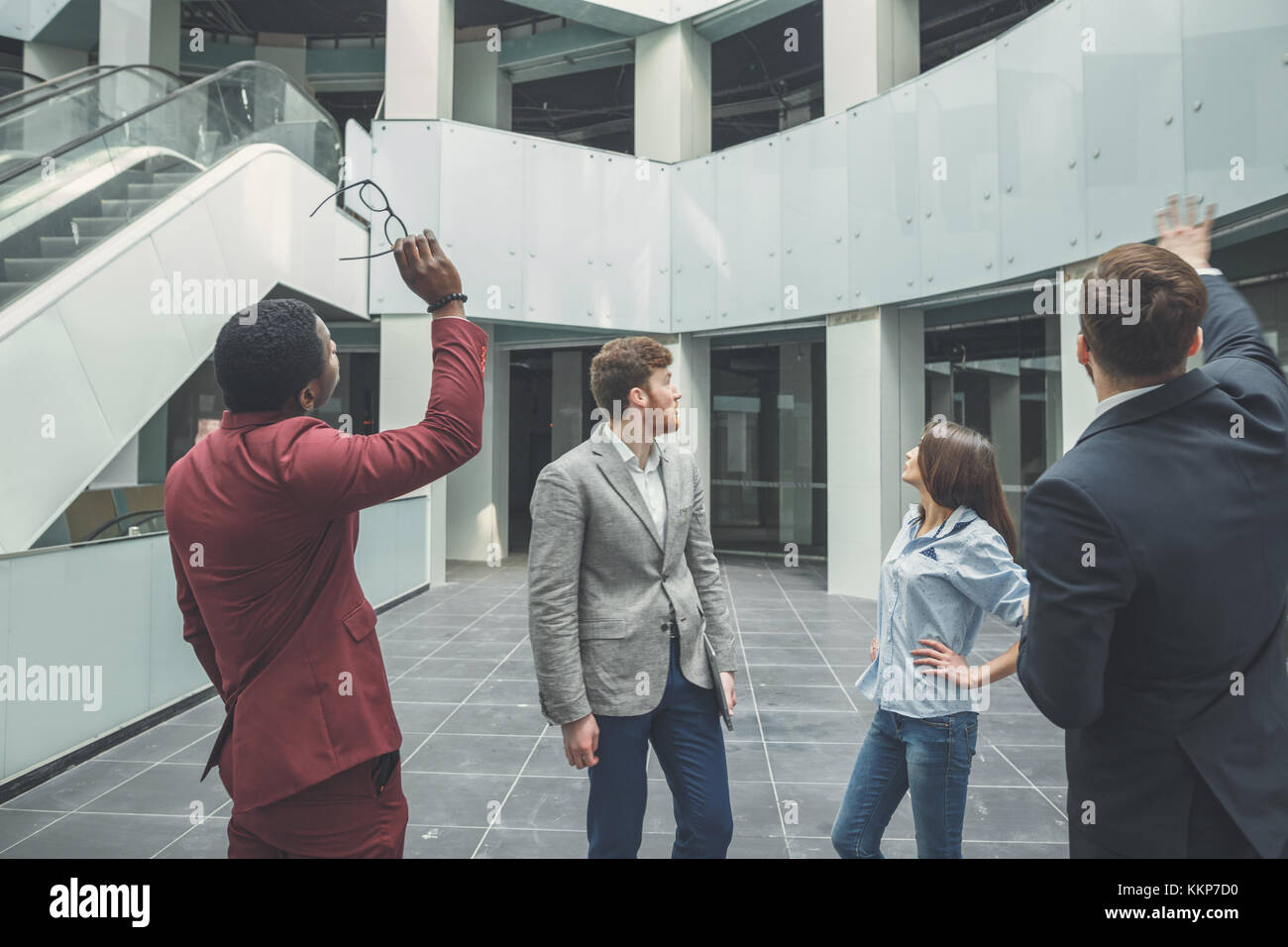 Architects and workers inside building under construction Stock Photo ...