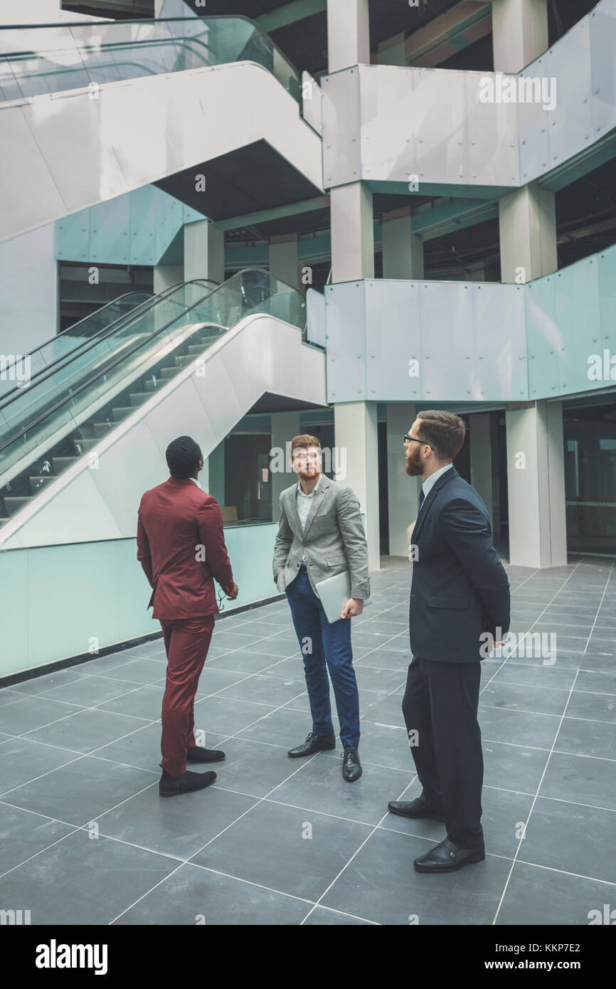 Architects and workers inside building under construction Stock Photo ...
