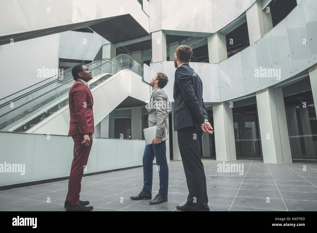 Architects and workers inside building under construction Stock Photo ...