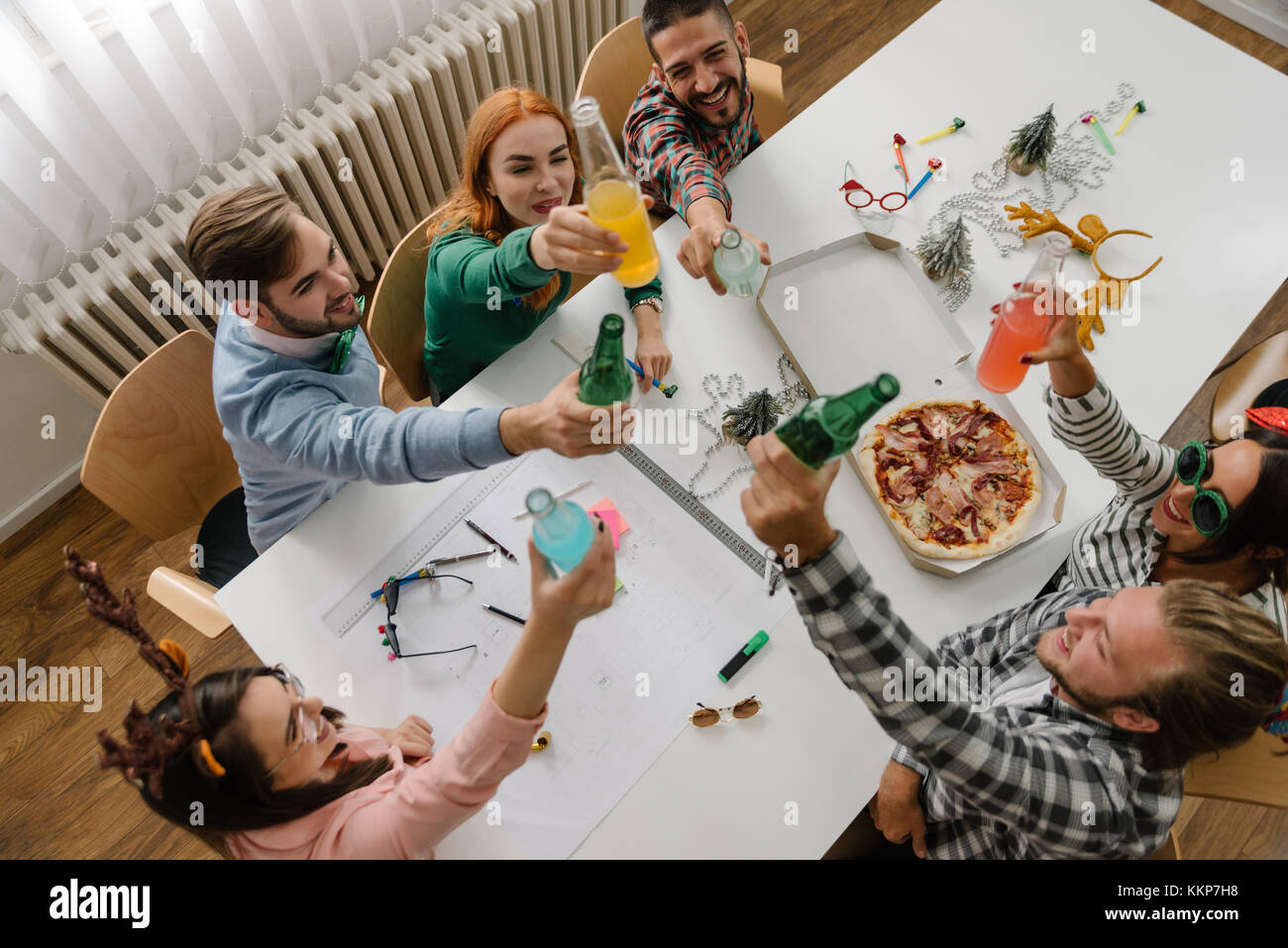 Team enjoying pizza together hi-res stock photography and images - Alamy