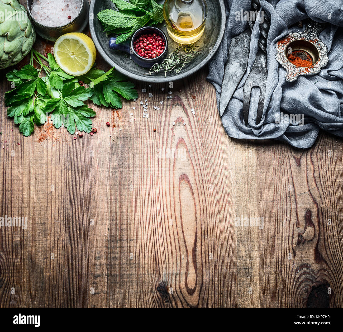 Fresh condiment and seasoning food setting on rustic kitchen table ...