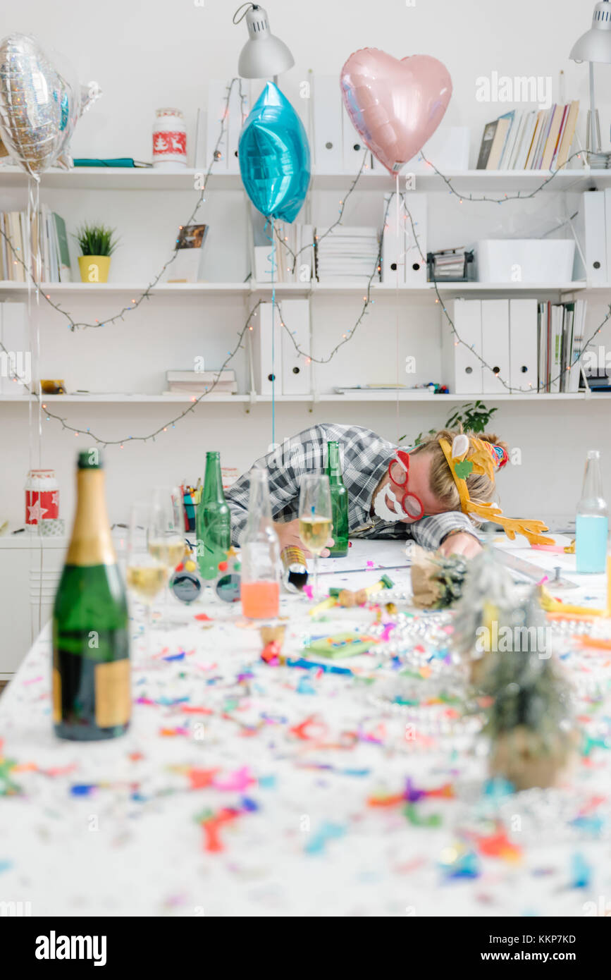 Intoxicated employee left alone after the party Stock Photo - Alamy