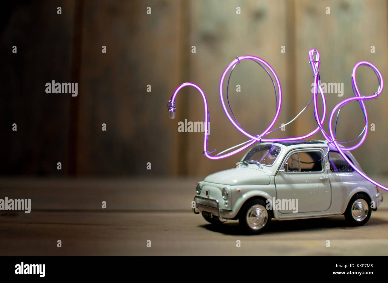 2018 neon sign on top of a toy car Stock Photo - Alamy