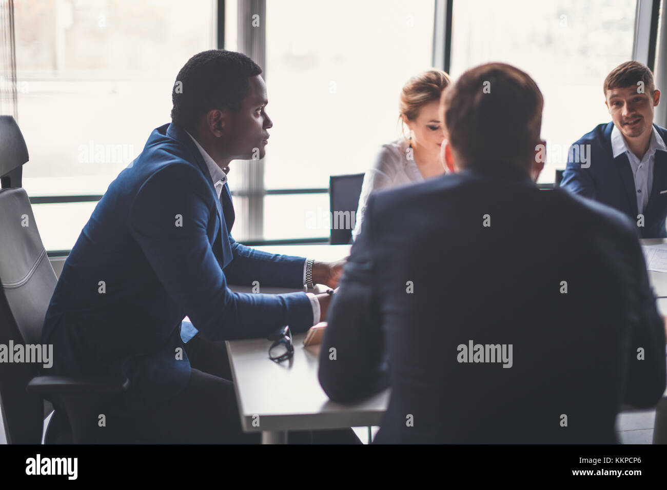 Boss heading a business reunion with partners Stock Photo - Alamy